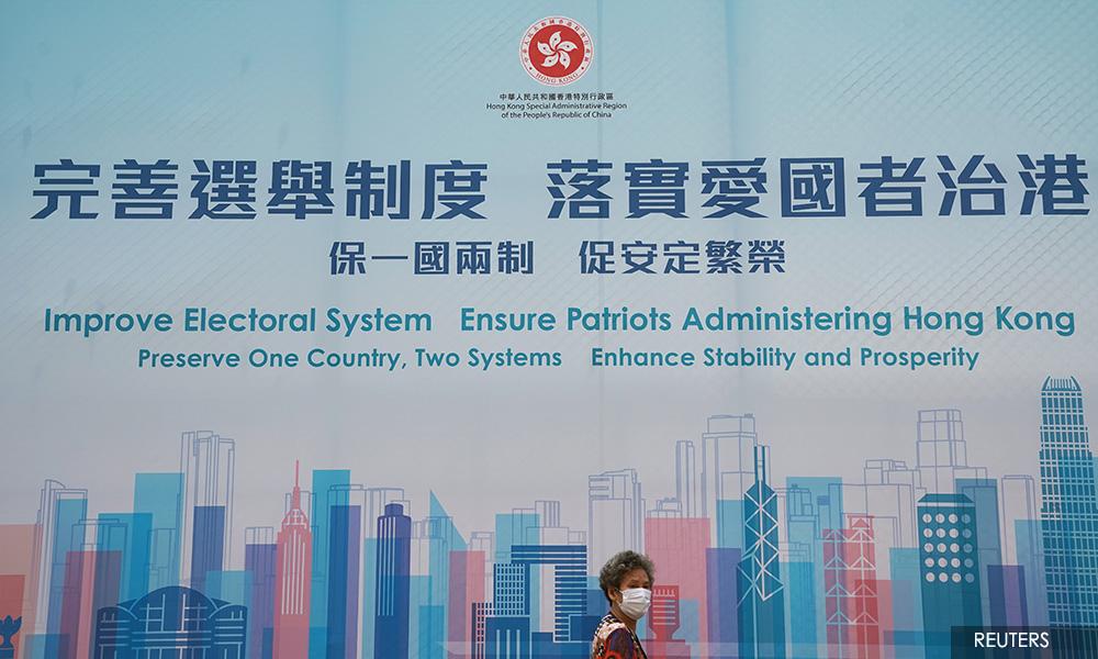 China approves sweeping electoral shake-up for Hong Kong, demands loyalty